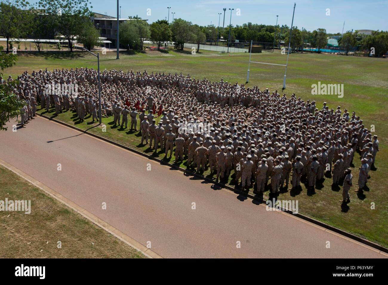 U.S. Marines with 1st Battalion, 1st Marine Regiment, listen to U.S ...