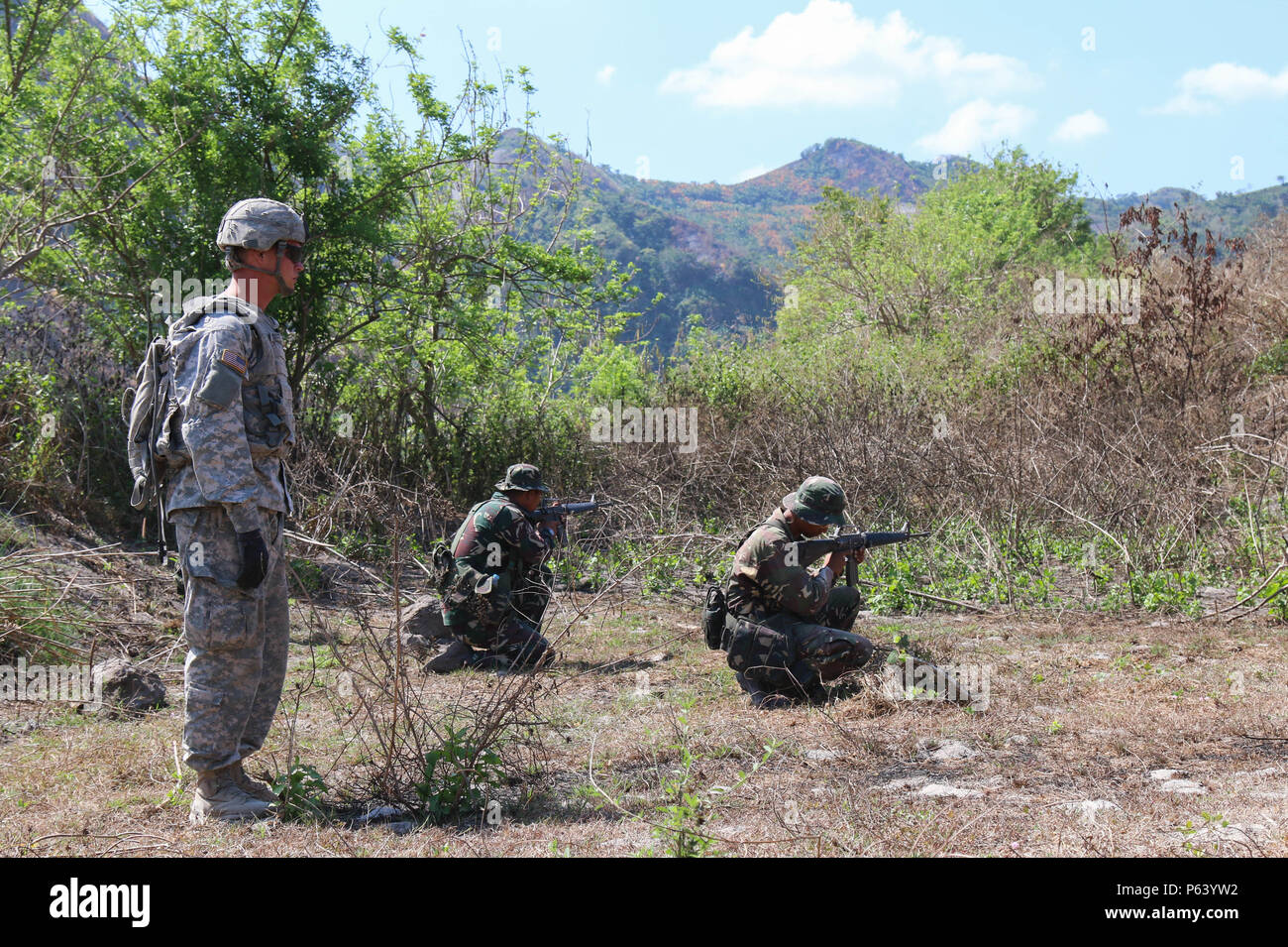 An infantryman observes Armed Forces of the Philippines soldiers while ...