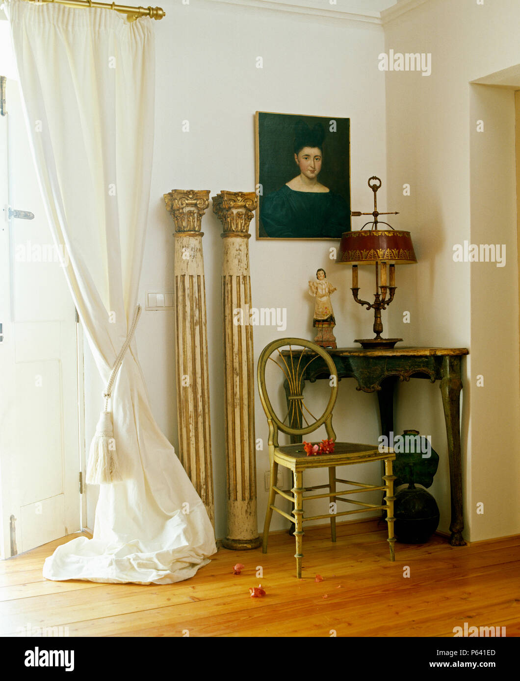 Pair of neo-classical columns beside antique chair and corner table in ...
