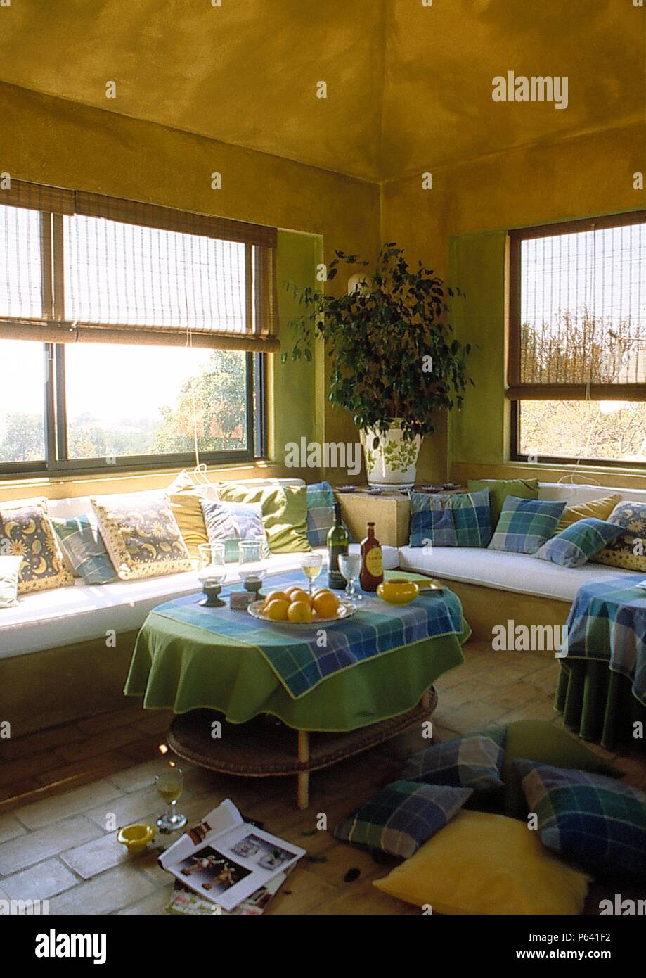Cushioned seating around in old fashioned sitting room Stock Photo - Alamy