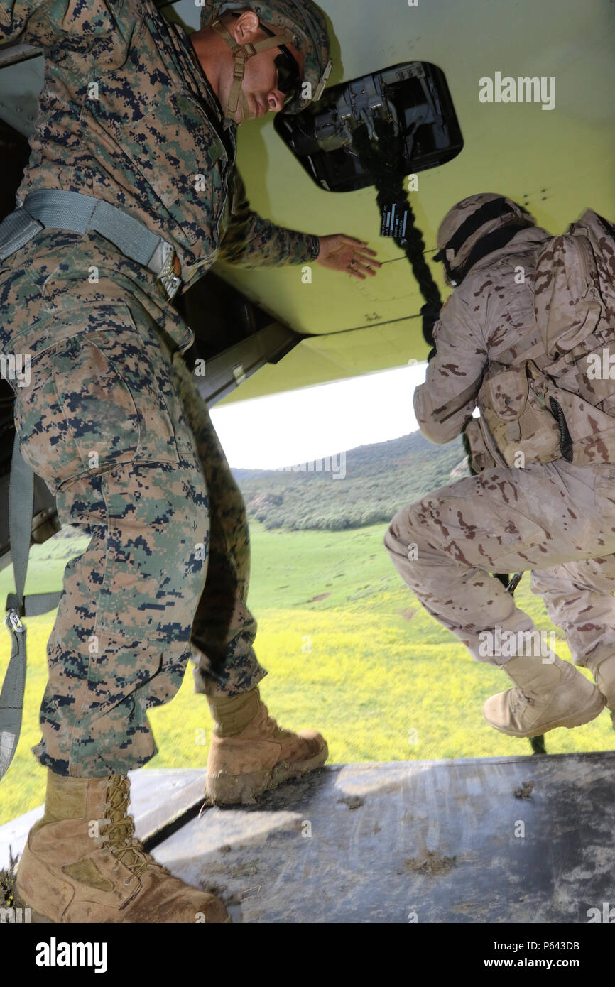 U.S. Marine Corps Staff Sgt. Alex A. Quinones, (left), Helicopter Rope ...