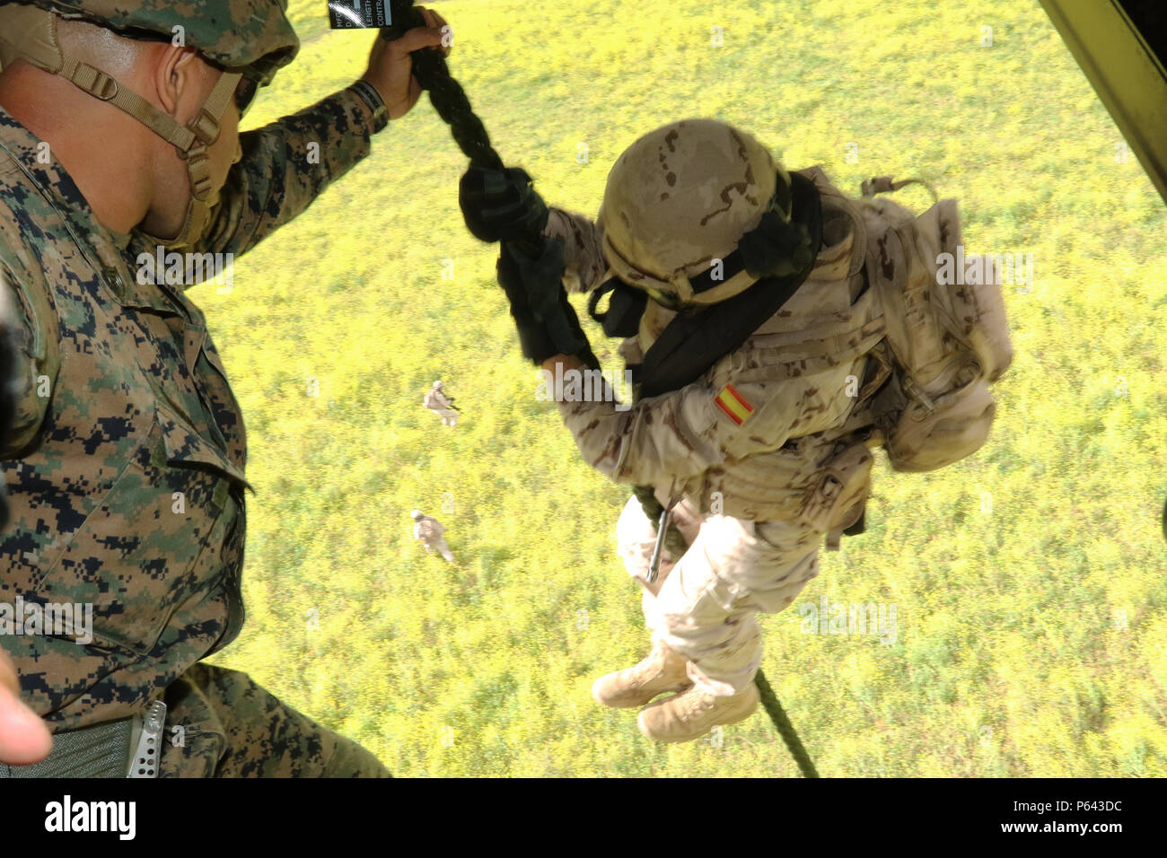 U.S. Marine Corps Staff Sgt. Alex A. Quinones, (left), Helicopter Rope ...