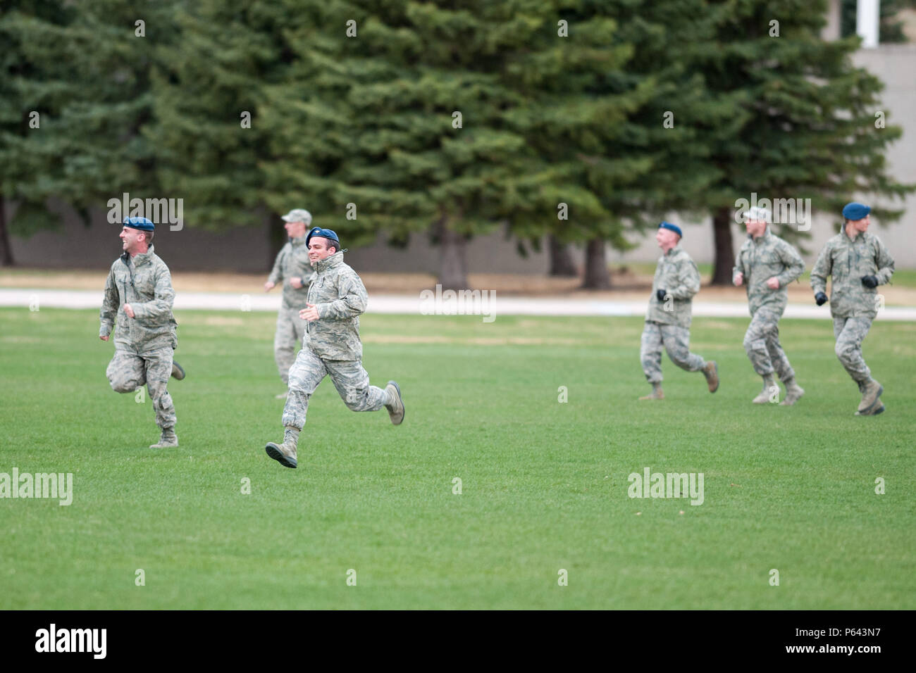 Cadets run toward a CV-22 Osprey on the U.S. Air Force Academy's ...