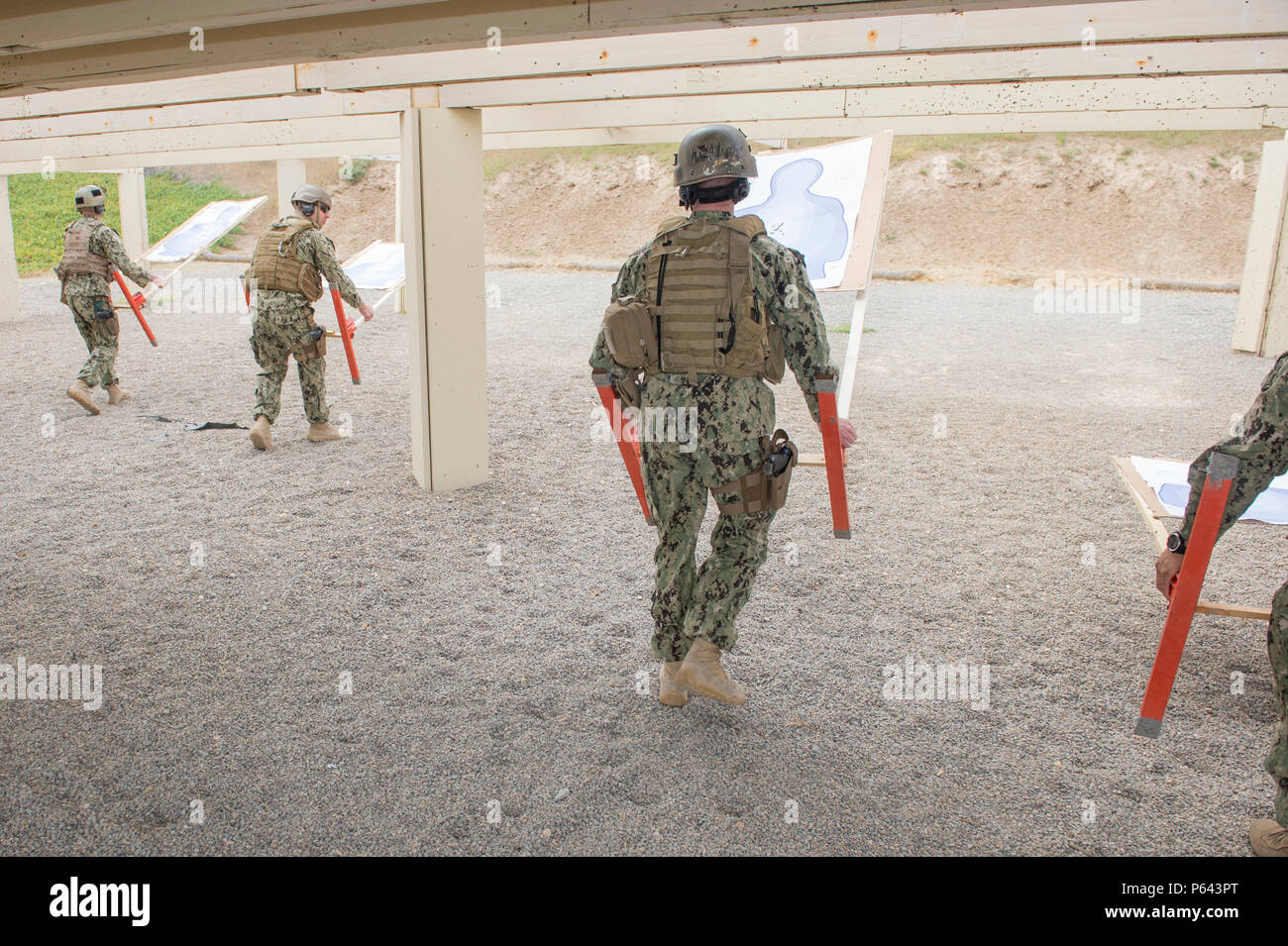 Sailors assigned to Fleet Combat Camera Pacific (FCCP) move and set up ...