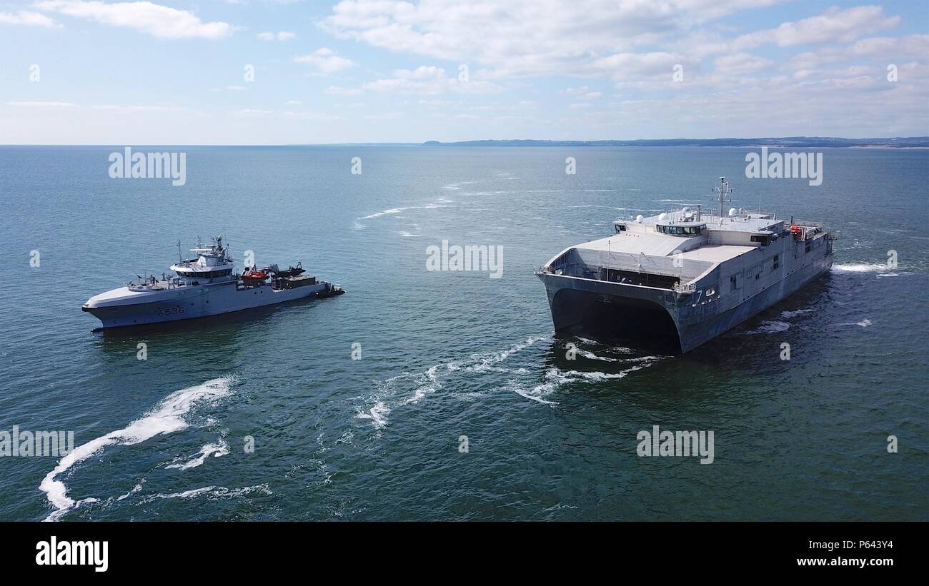 USNS Carson City (right) conducts maneuvers with Norwegian vessel Olav ...