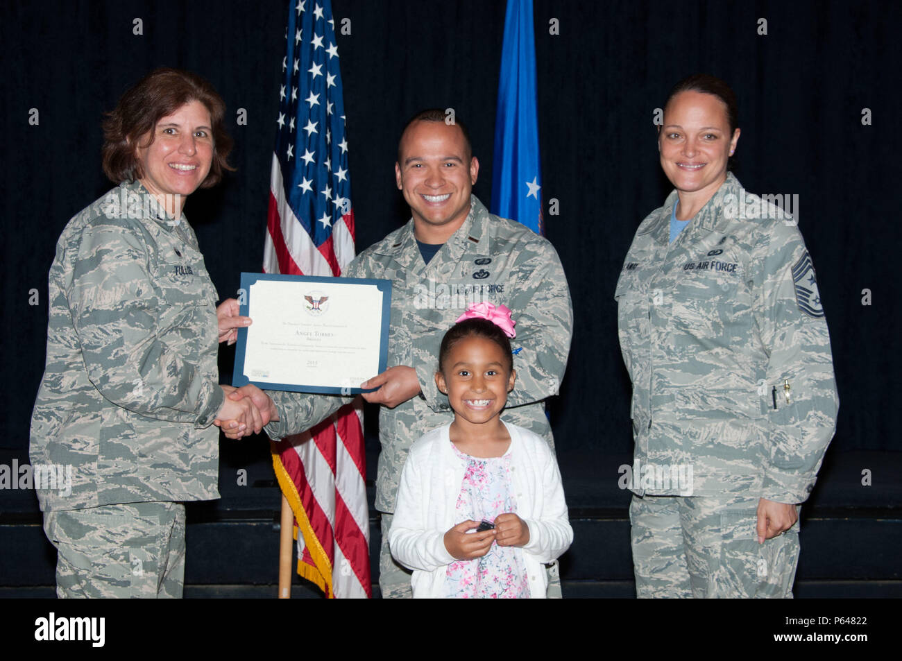 Isabella Torres poses with her father, 2nd Lt. Angel Torres, Air Force ...