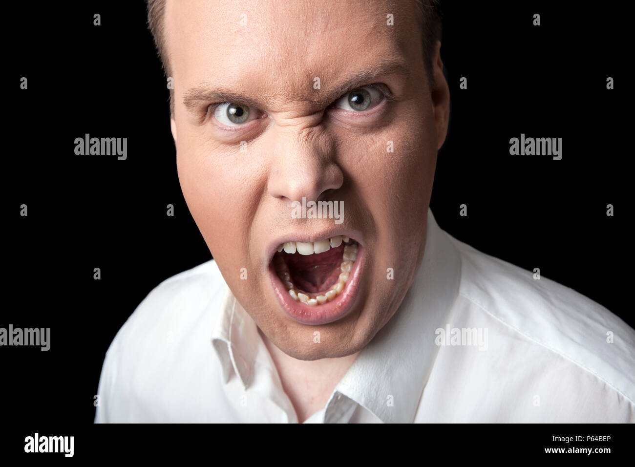 face screaming men on a black background Stock Photo - Alamy