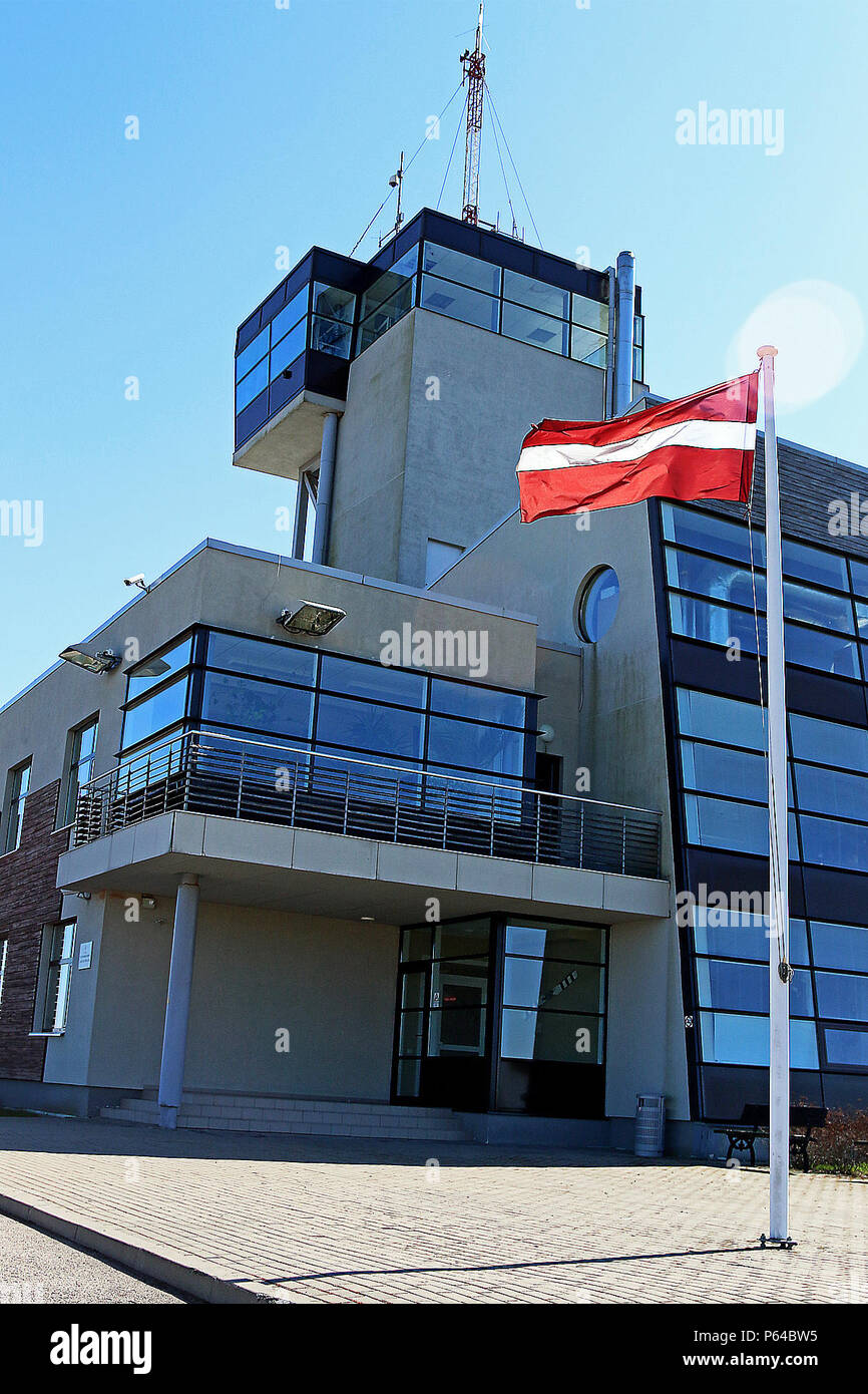 The Latvian flag flies tall in front of the Latvian Border Guard ...