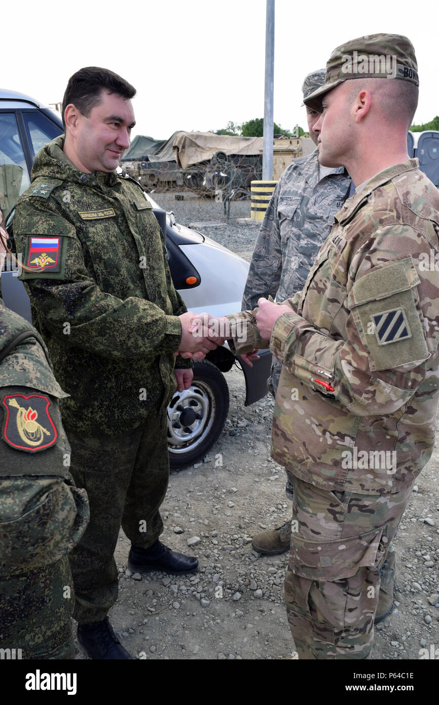 A Russian Soldier presents Maj. Bryan Bonnema, the Executive Officer ...