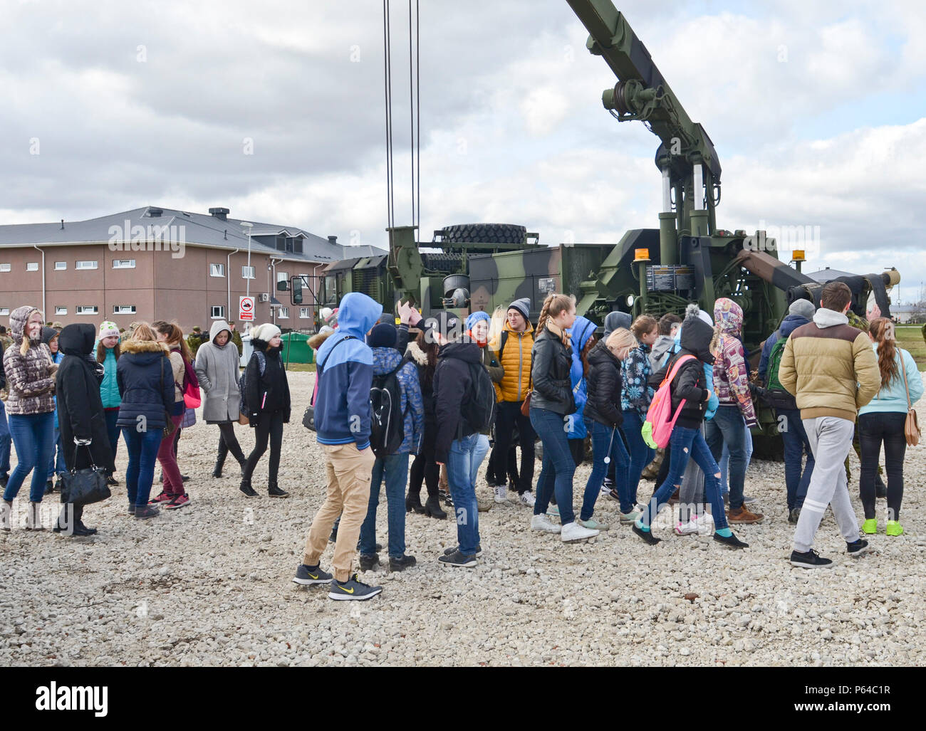 School-aged children walk around a U.S. Army M984A4 Heavy Expanded ...