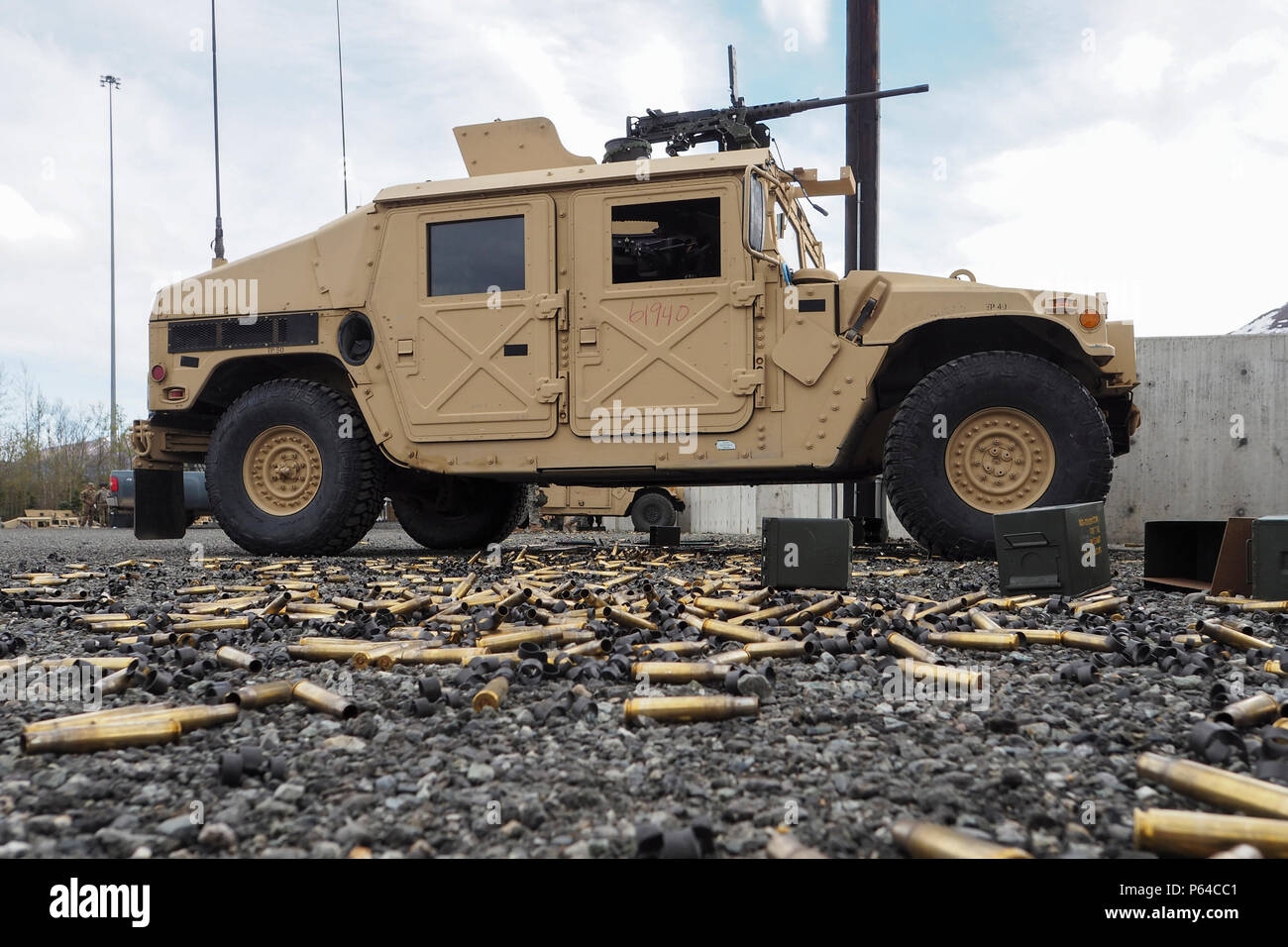 Expended .50 Caliber shells and links lay scattered on the ground after ...