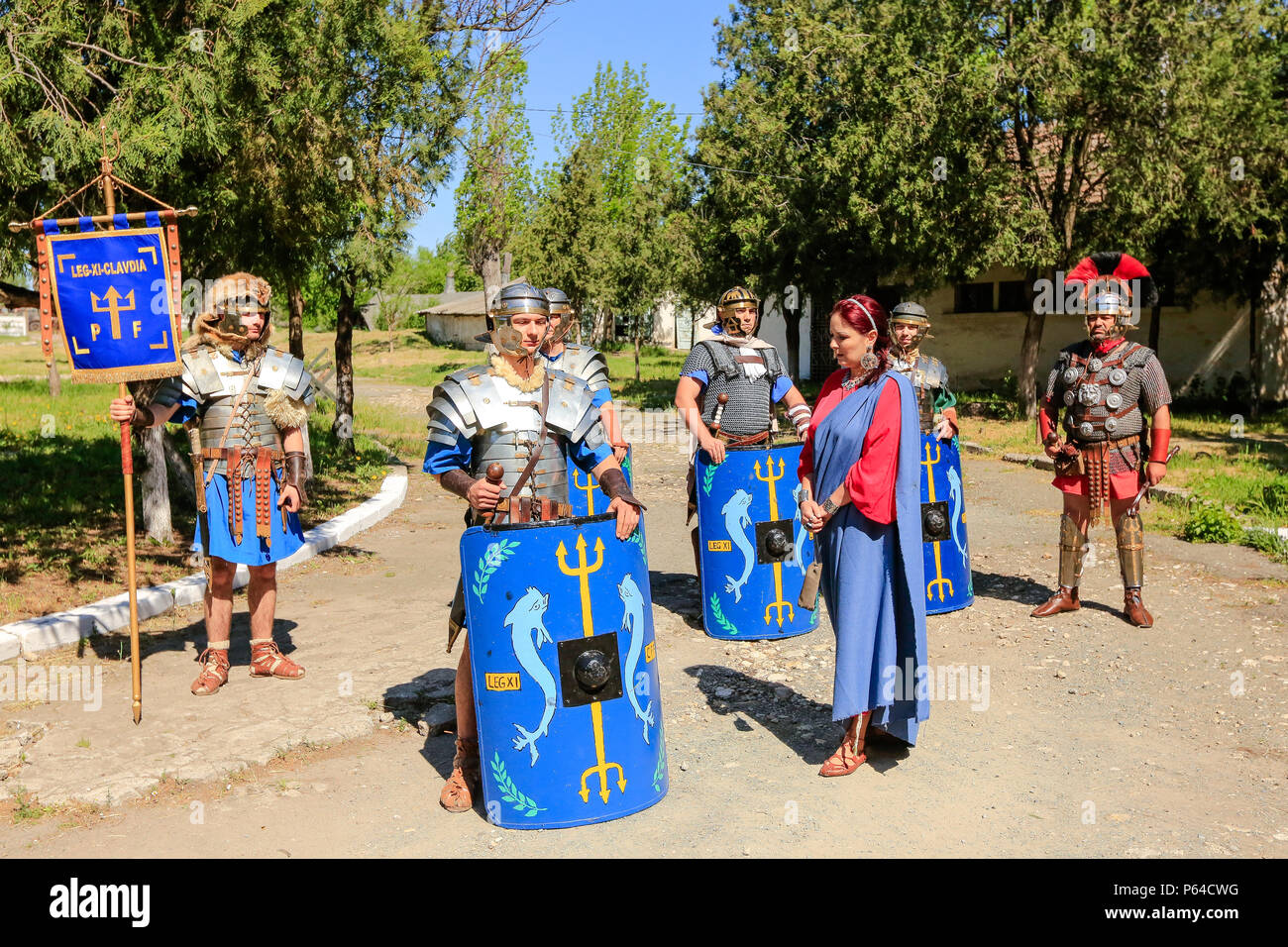 A Roman woman role-player explains to U.S. and Romanian Forces, not ...