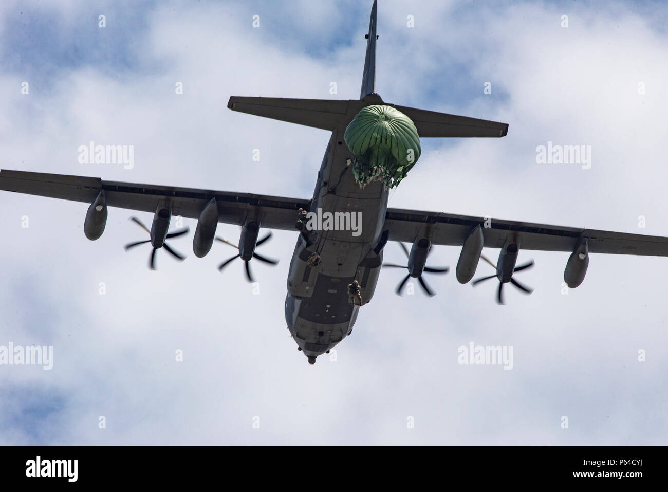 U.S. Air Force Airmen from the 820th Base Defense Group parachute out ...