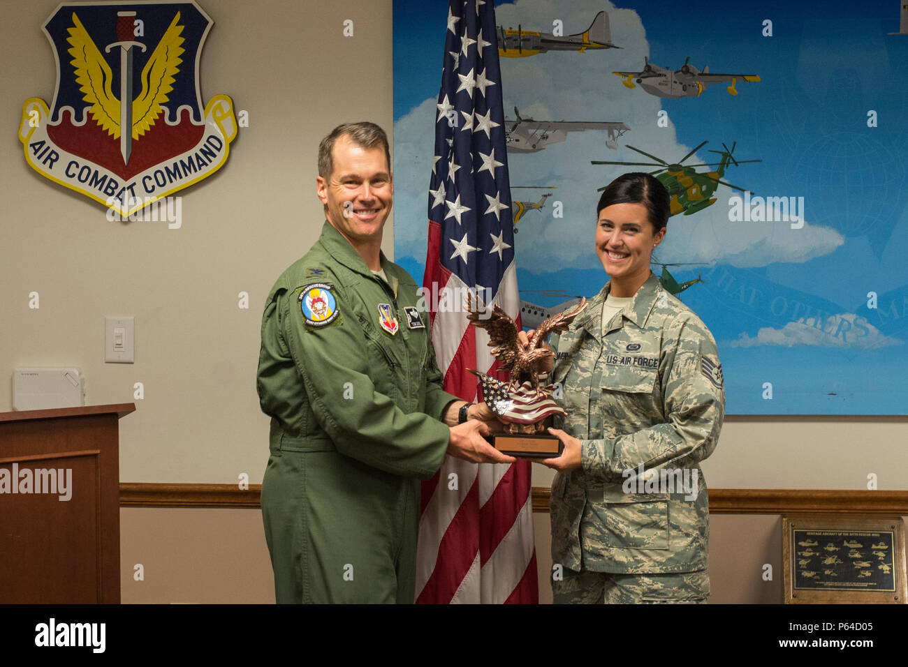 U.S. Air Force Col. Thomas Dorl, 347th Rescue Group commander, presents ...