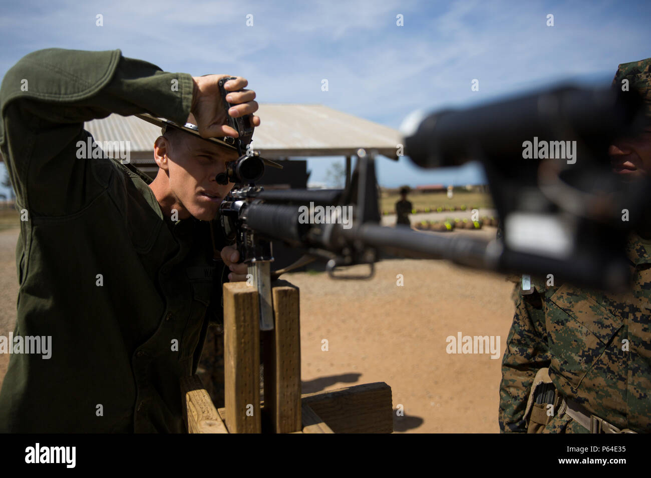 U.S. Marine Corps Sgt. Alec C. Ward, a primary marksmanship instructor ...