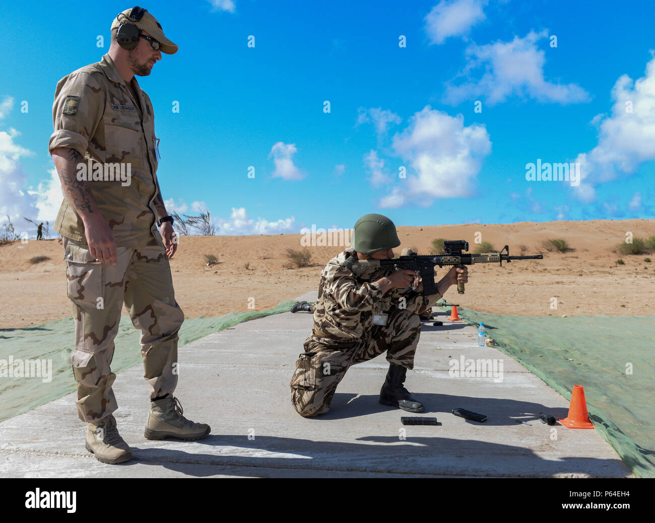 A Royal Netherlands Armed Forces soldier watches a Moroccan Royal Armed ...