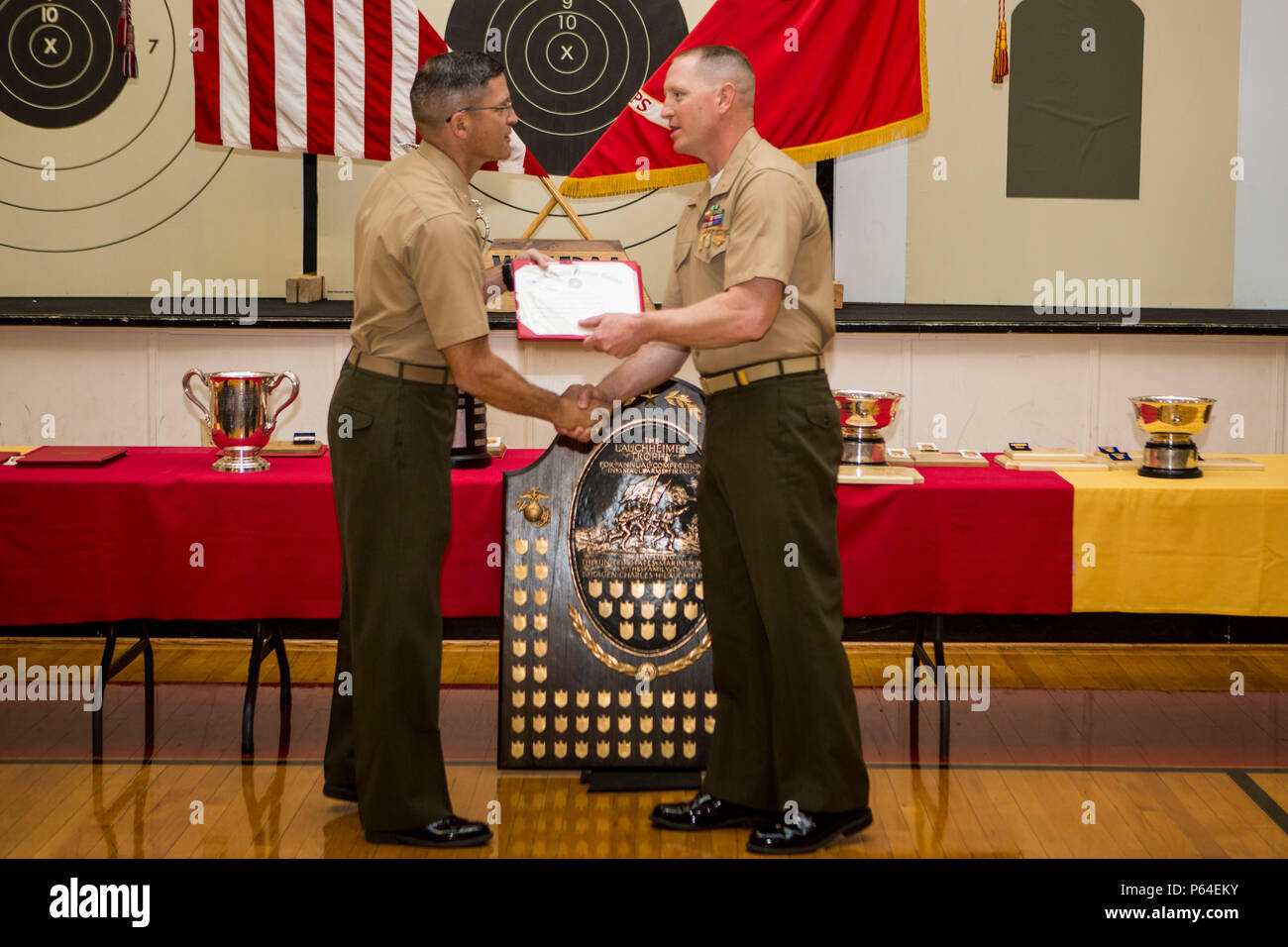 The deputy commander of Marine Corps Installations East awards a ...