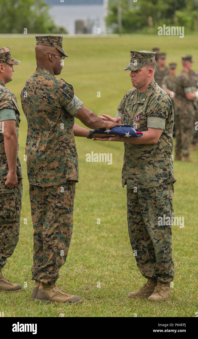 U.S. Marine Corps Lt. Col. Clennon Roe, presents Maj. Christopher T ...