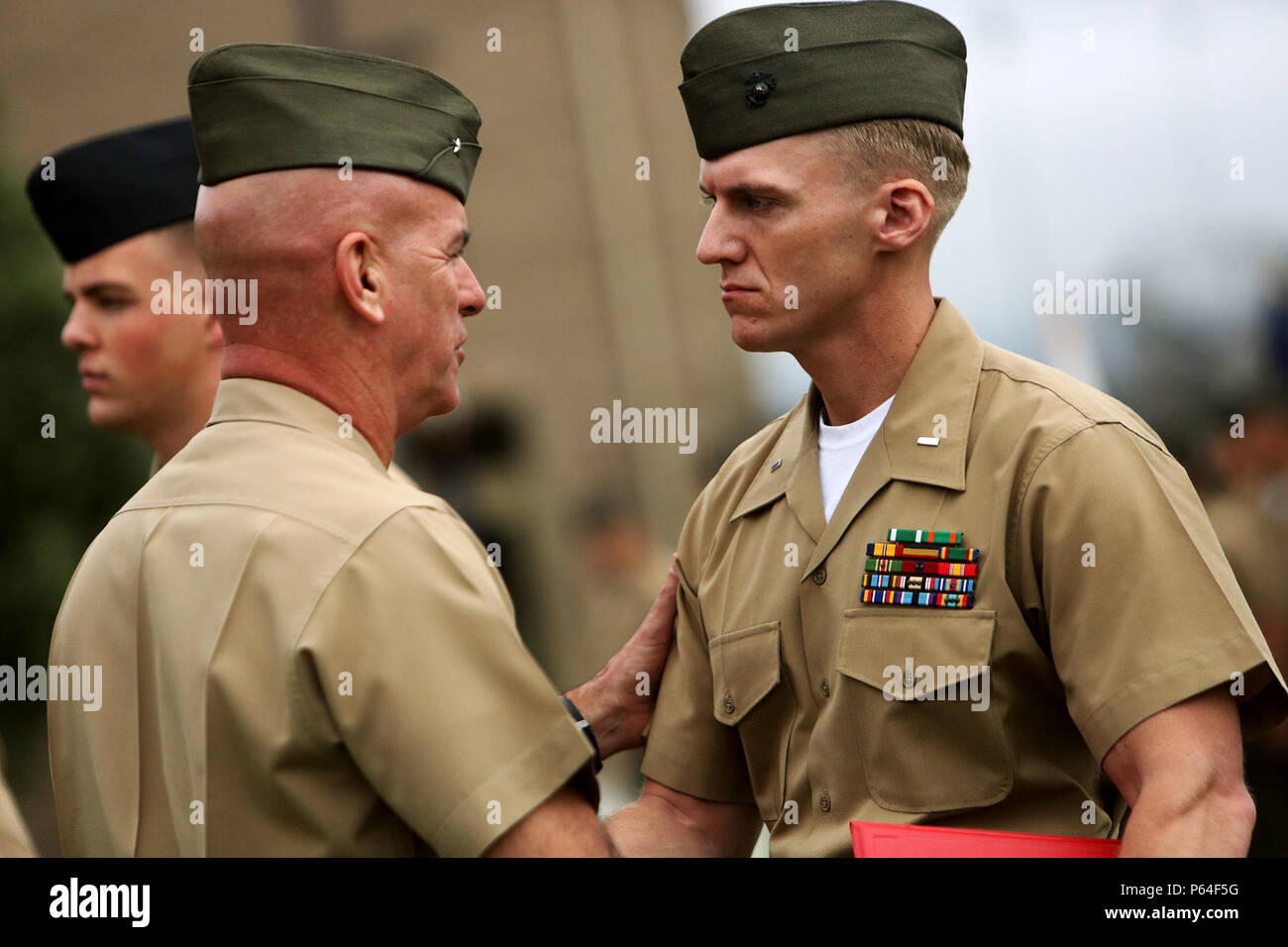 U.S. Marine 1st Lt. Frankie Doerr is handed an award during an awards ...