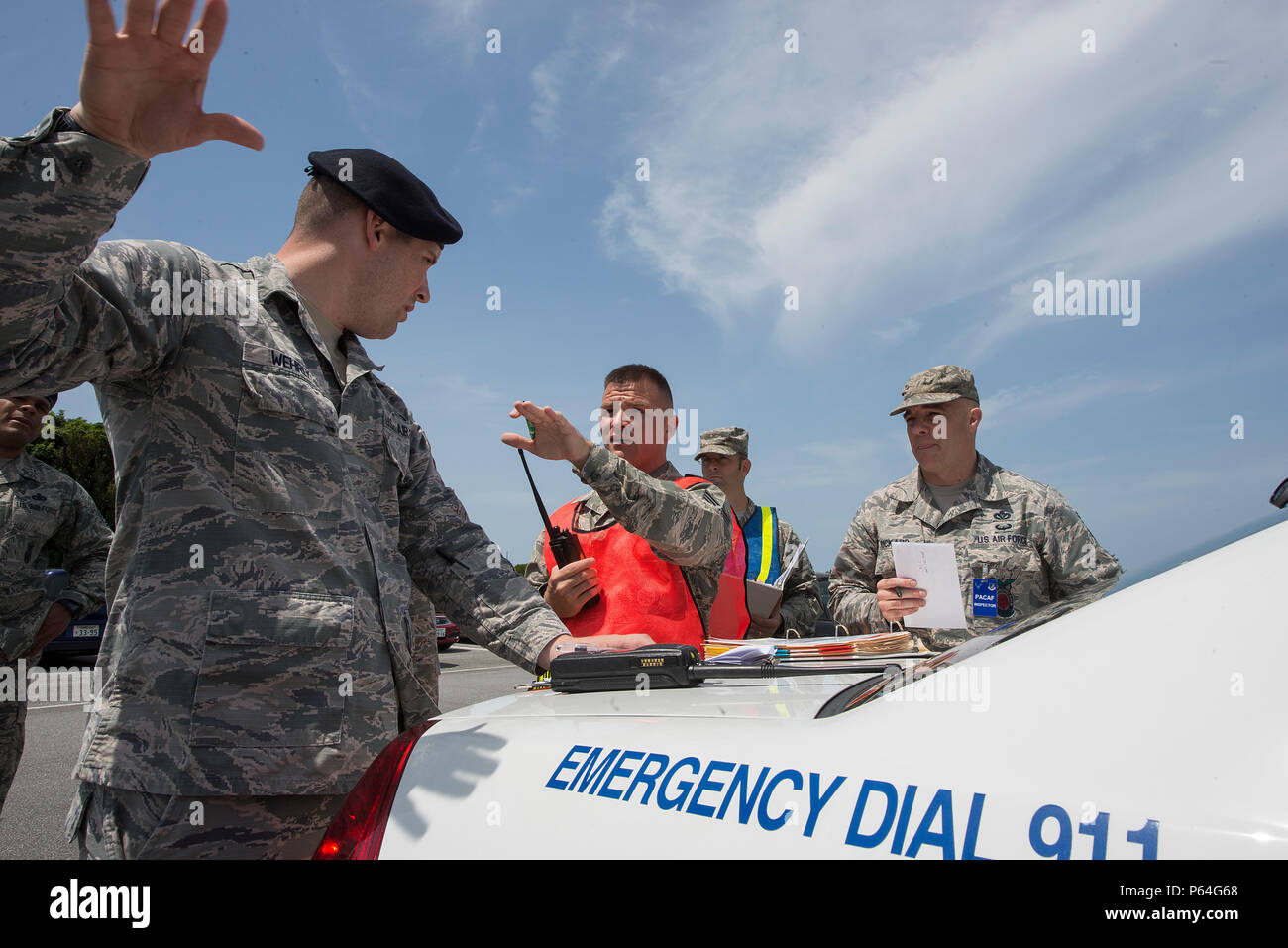 U.S. Air Force emergency responders discuss procedures during an active ...