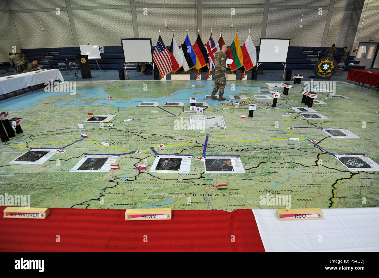 U.S. Soldiers with 2nd Cavalry Regiment use a large vinyl map (produced ...