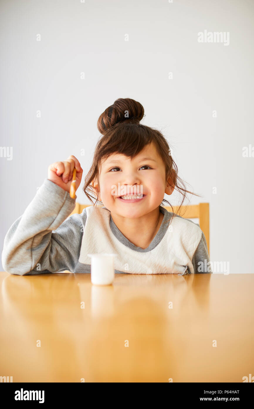 Cute Japanese kid having a snack Stock Photo - Alamy