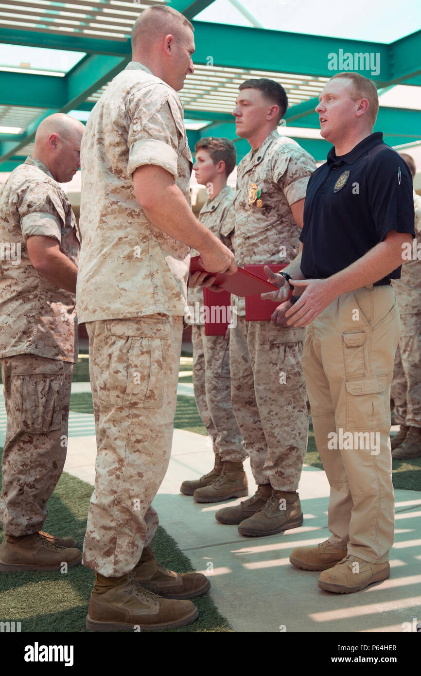 Maj. Daniel Lammers, Combat Center Provost Marshal, presents Officer ...