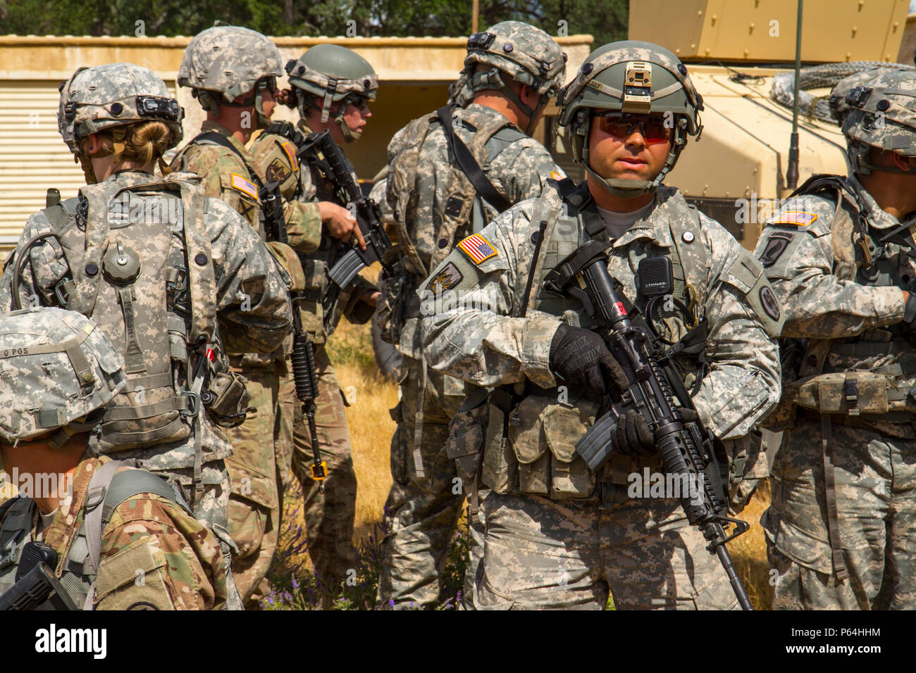 U.S. Army soldiers from the 56th Military Police Company rally during a ...