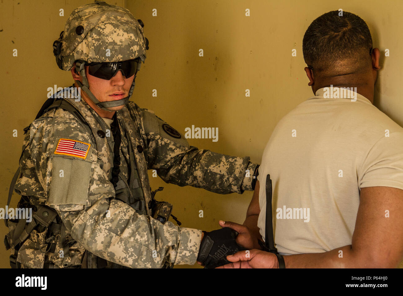 U.S. Army Spc. Konner Klein of the 56th Military Police Company secures ...