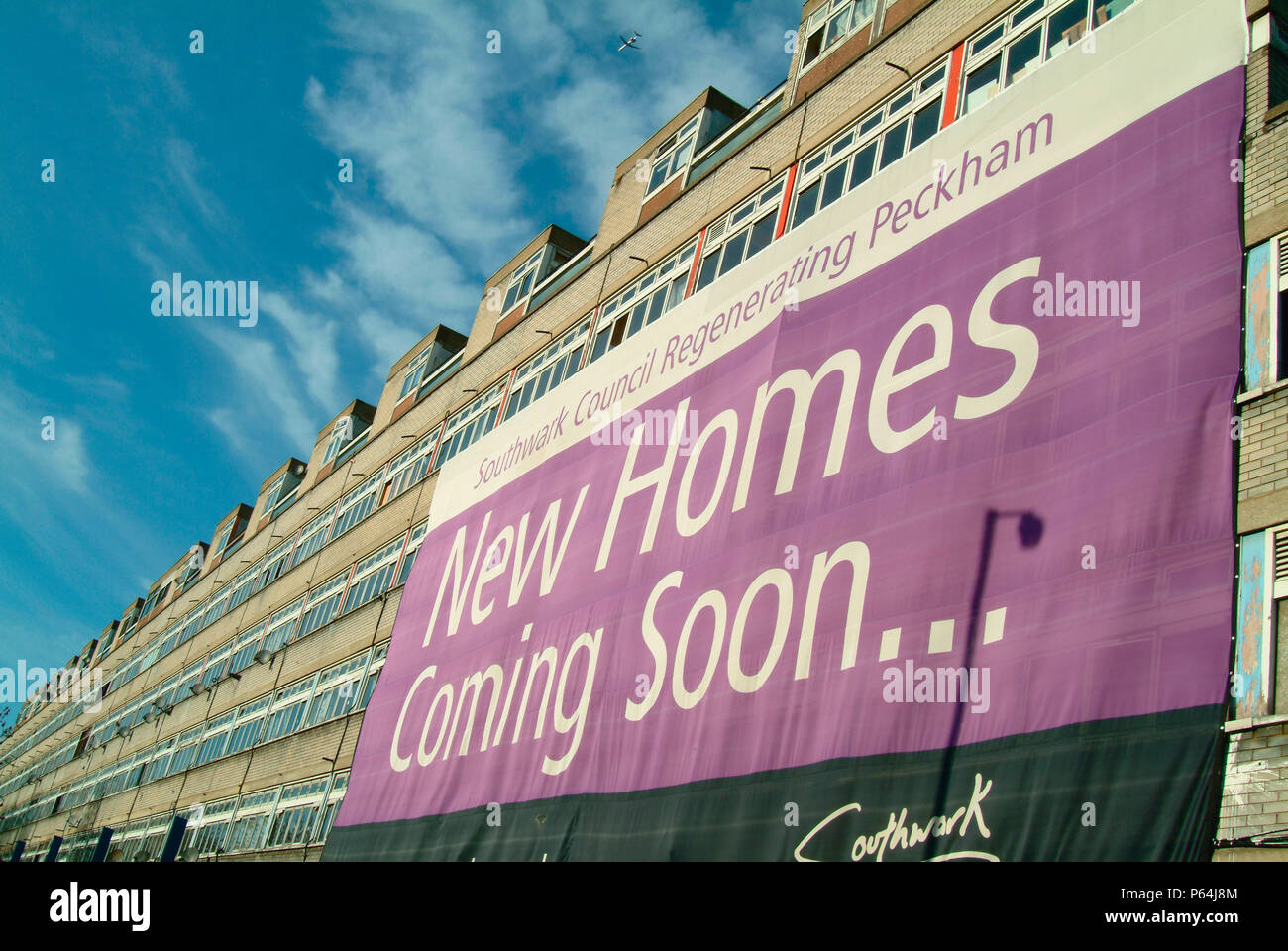 Giant shroud poster on condemned block of flats promising better future ...