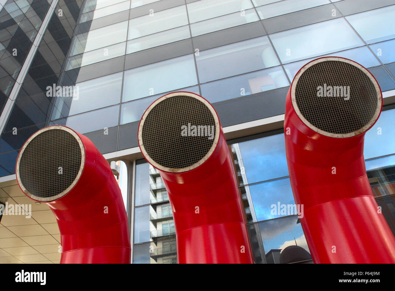 Red vent ducts outside office building Stock Photo - Alamy