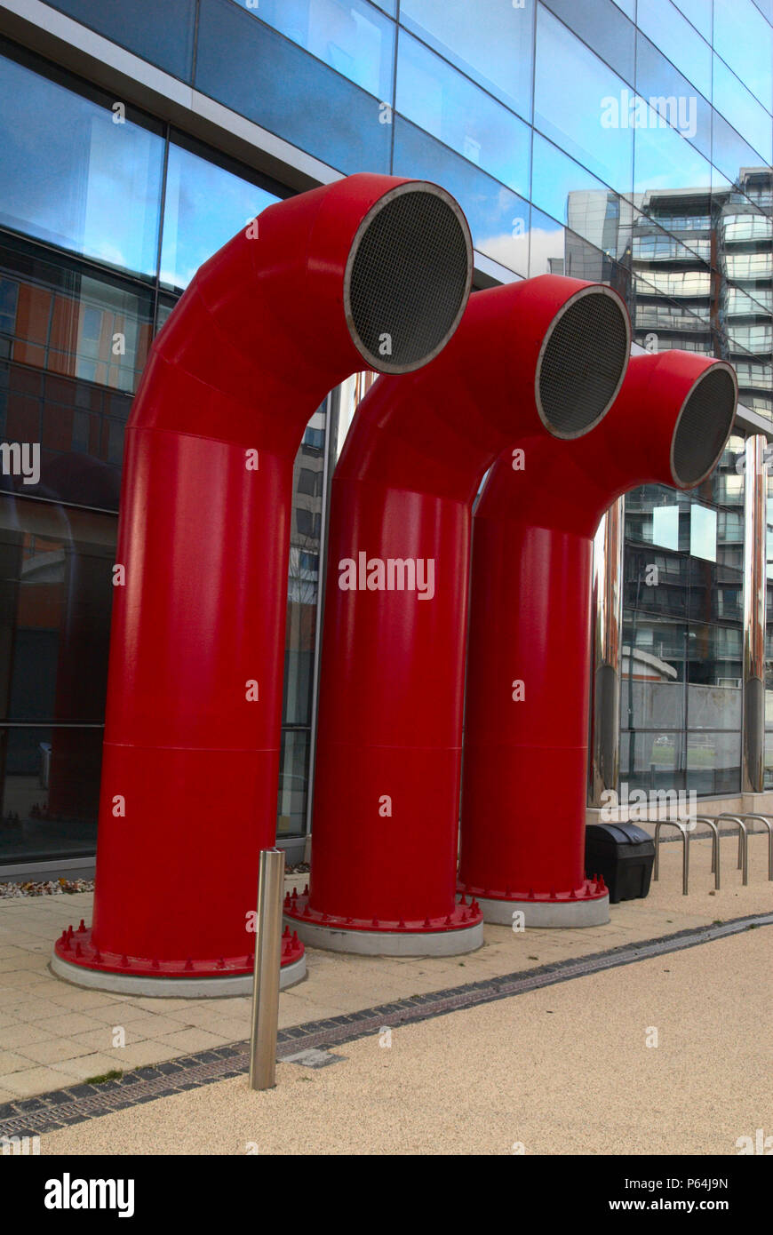 Red vent ducts outside office building Stock Photo - Alamy