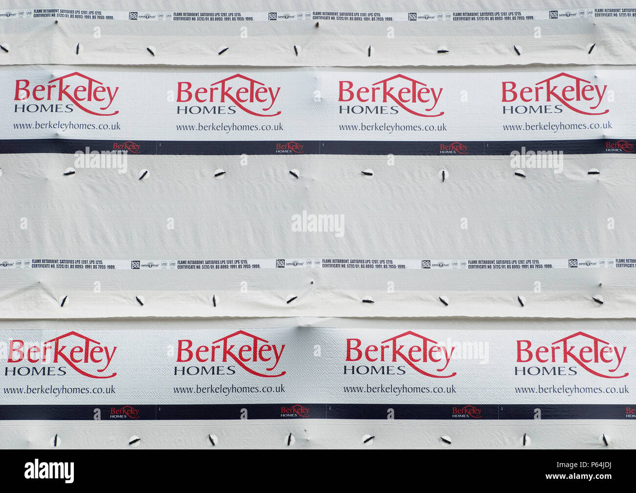 Protective hoarding on scaffolding surrounding a Berkeley Homes ...