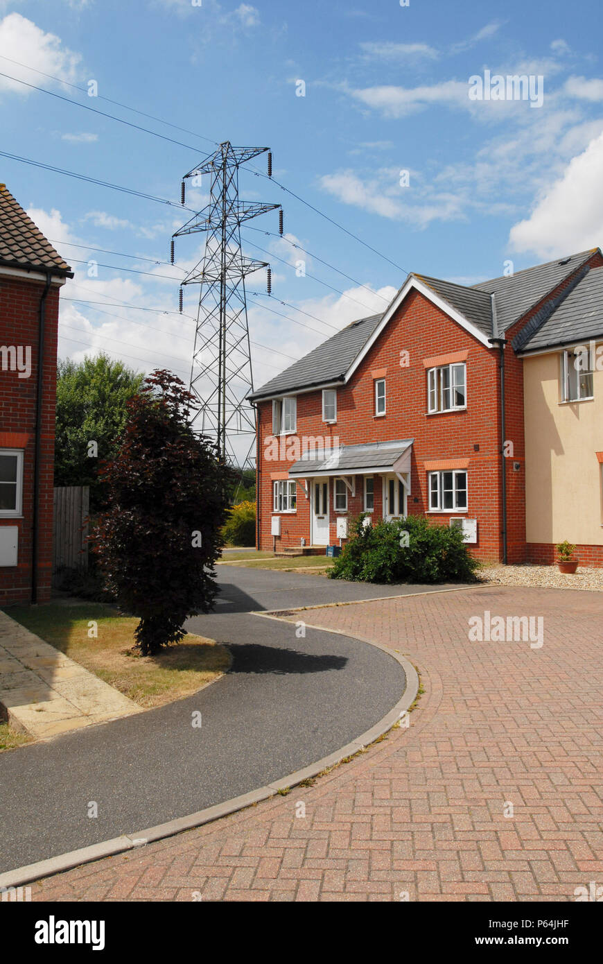 New housing estate with electric pylons in the background Stock Photo ...