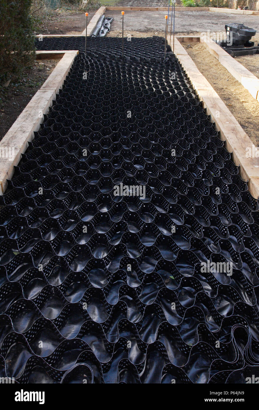 Recycled plastic being used in the base for laying concrete into a path ...