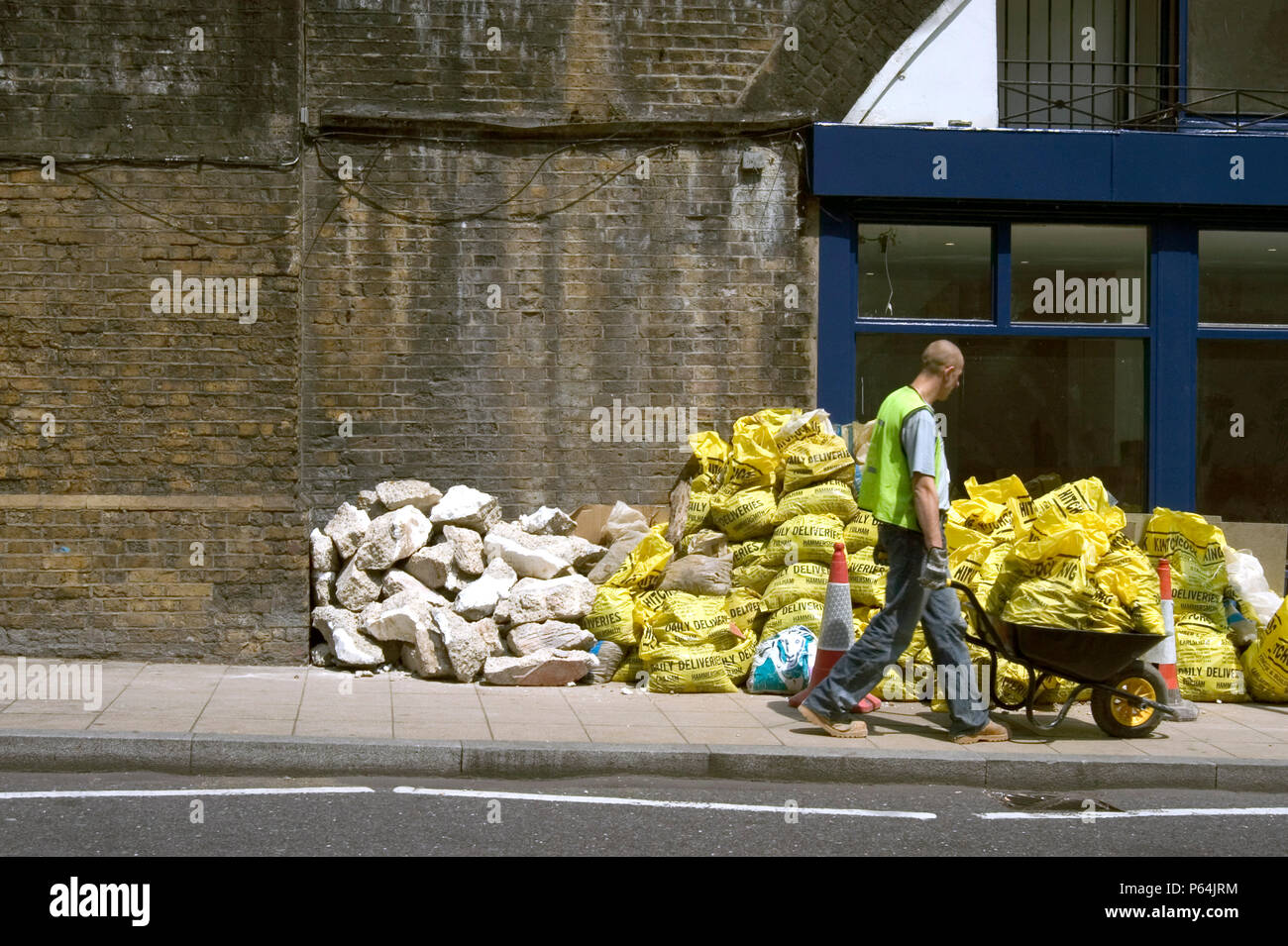 Construction waste on a pavement Stock Photo - Alamy