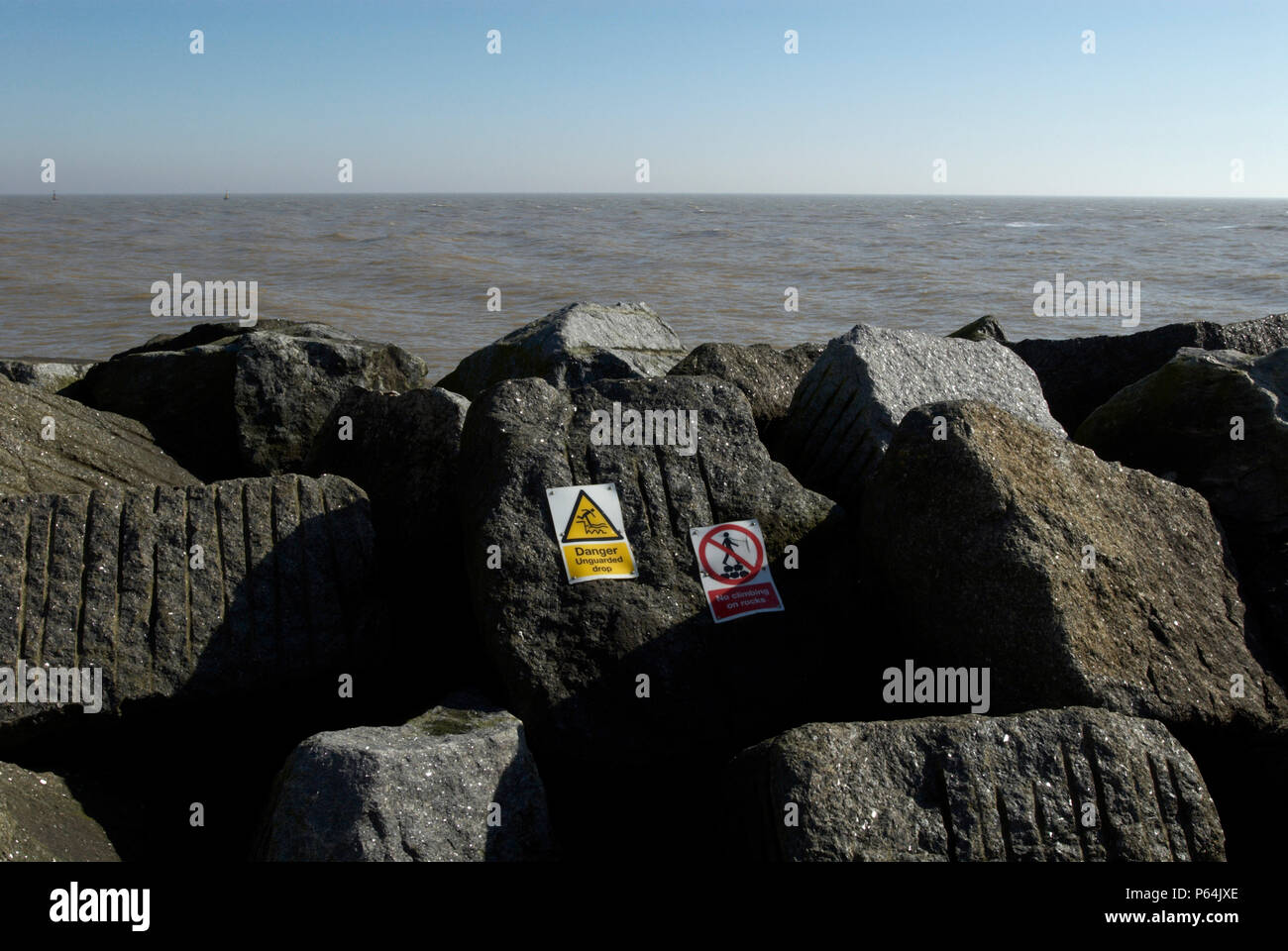 Danger sign on rocks hi-res stock photography and images - Alamy