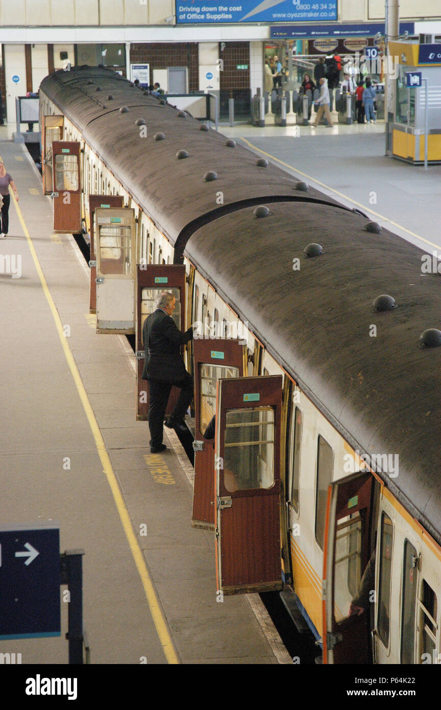 Passengers getting on a train at London Bridge train station Stock ...