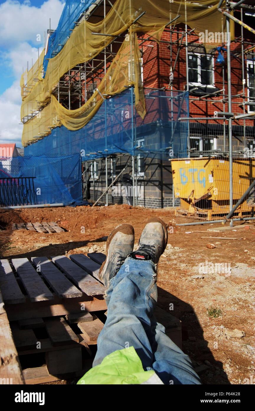 Construction worker enjoying a break on site Stock Photo - Alamy