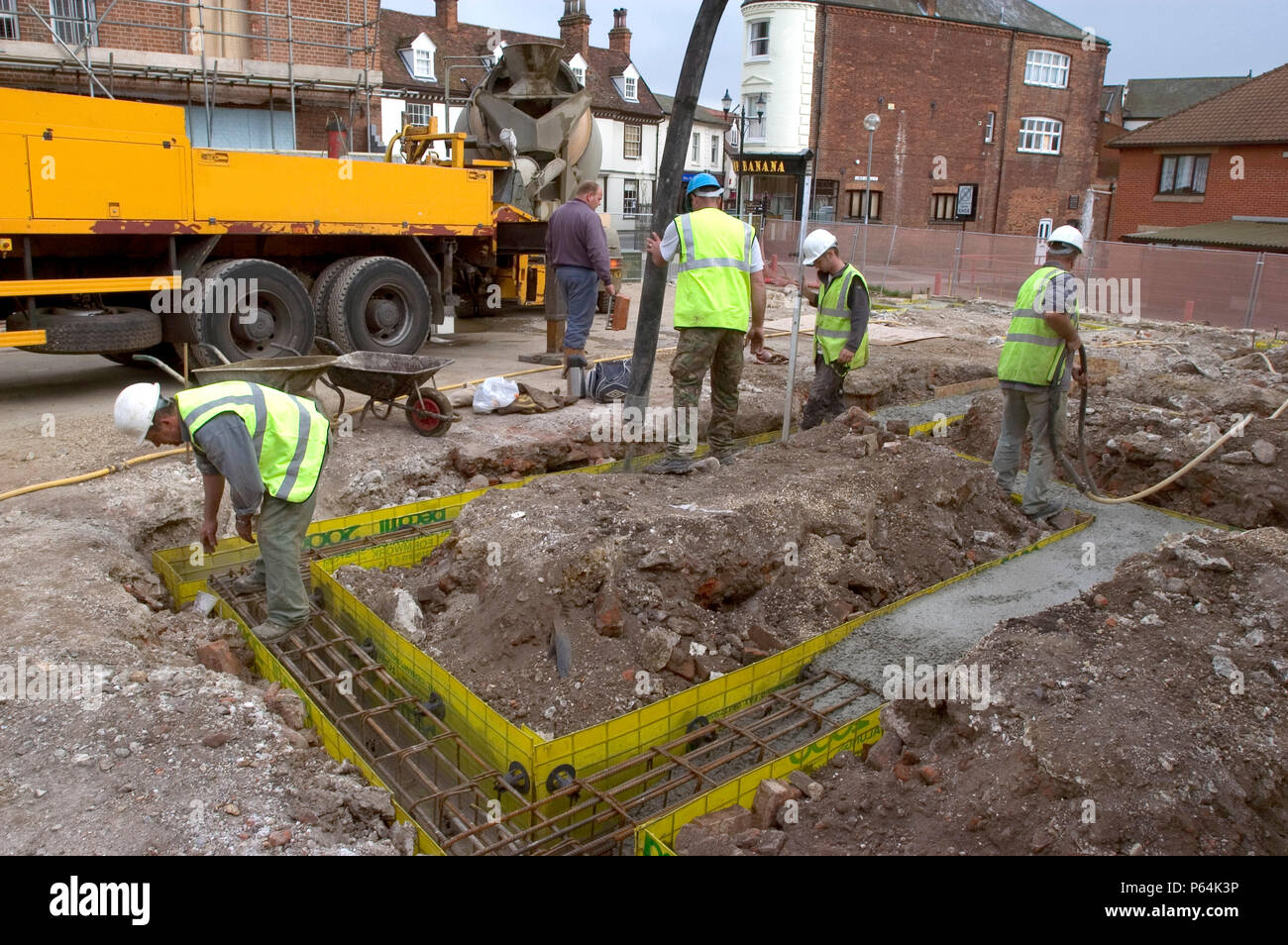 Cement truck pouring concrete. Groundwork for house building. Trench ...