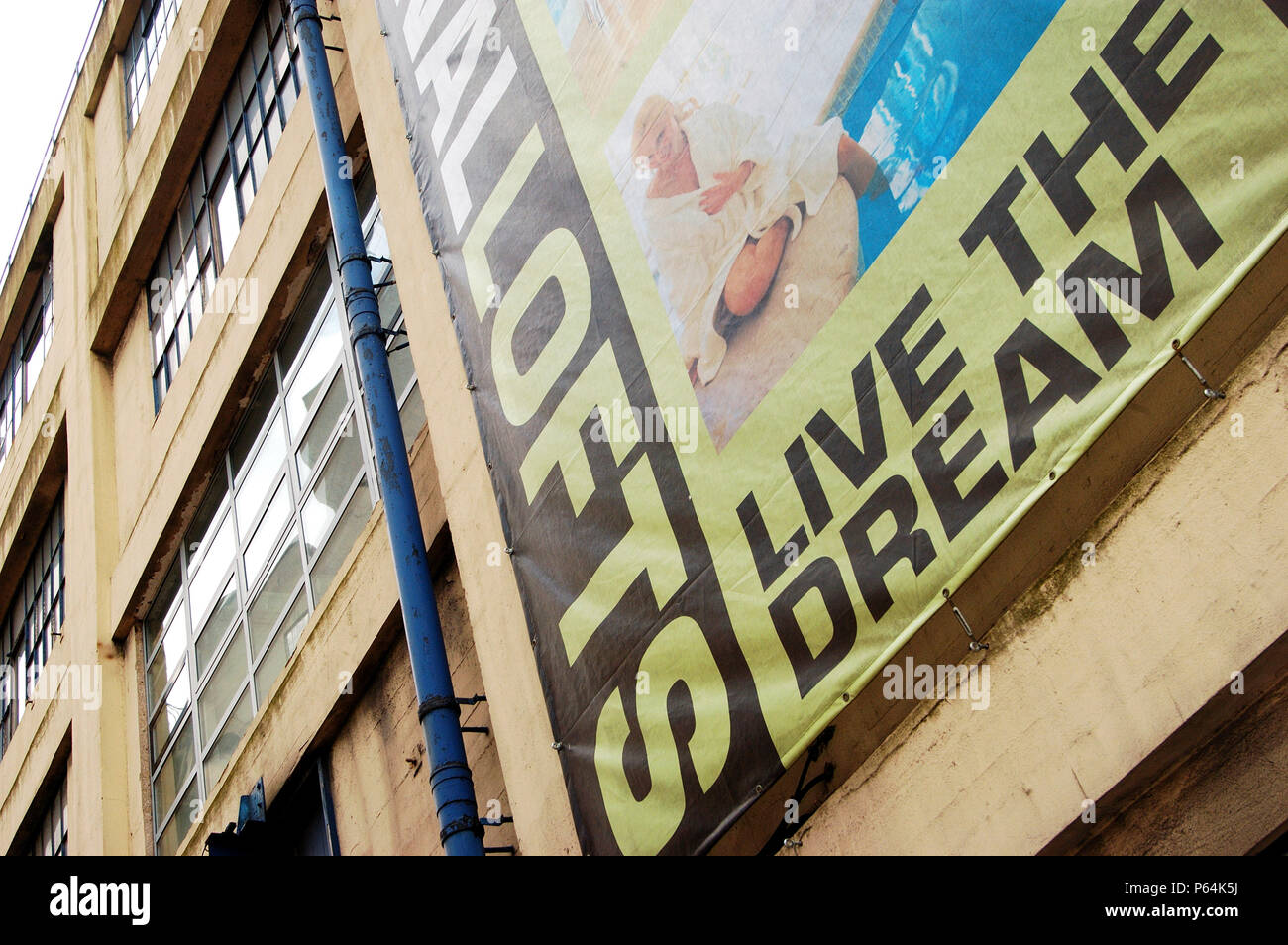 Large banner advertising on the facade of a new warehouse conversion ...