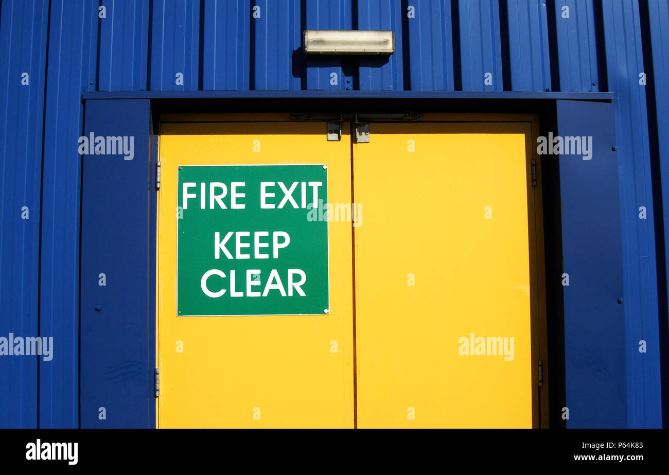 Brightly colored fire exit doors at a warehouse Stock Photo - Alamy