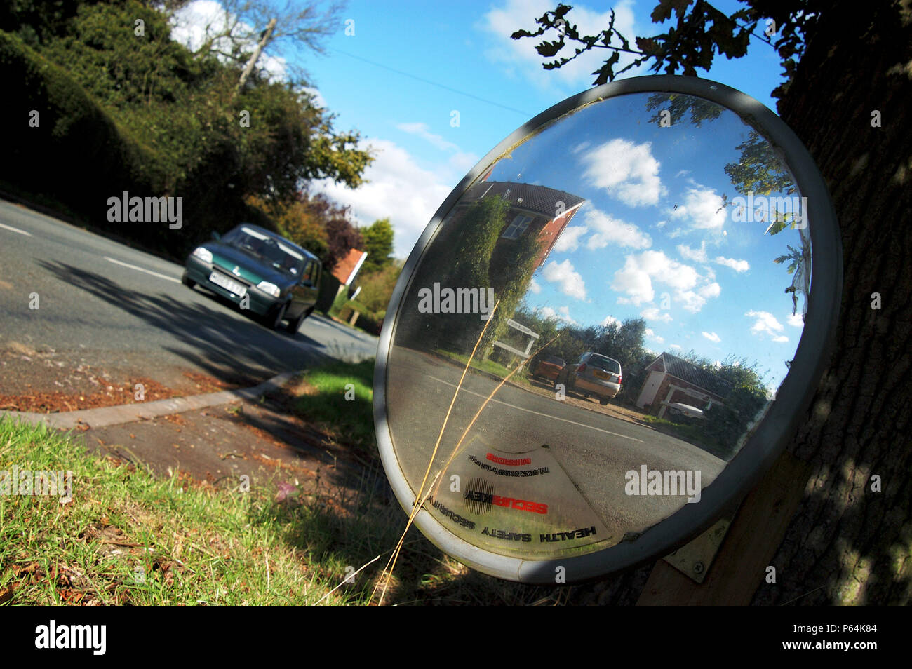 Safety roadside mirror for traffic in the countryside Stock Photo - Alamy