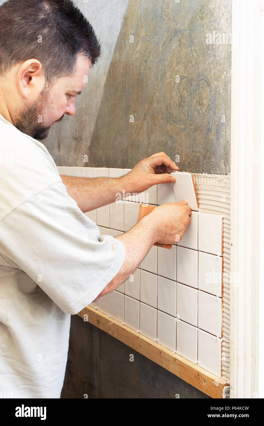 Tiling in progress Stock Photo - Alamy