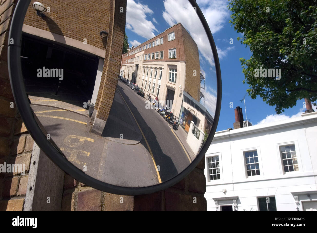 Safety roadside mirror for traffic in London Stock Photo - Alamy