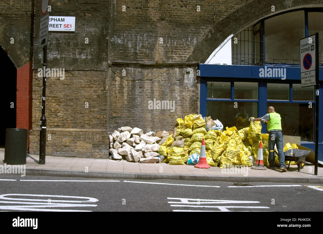 Construction waste on a pavement Stock Photo - Alamy