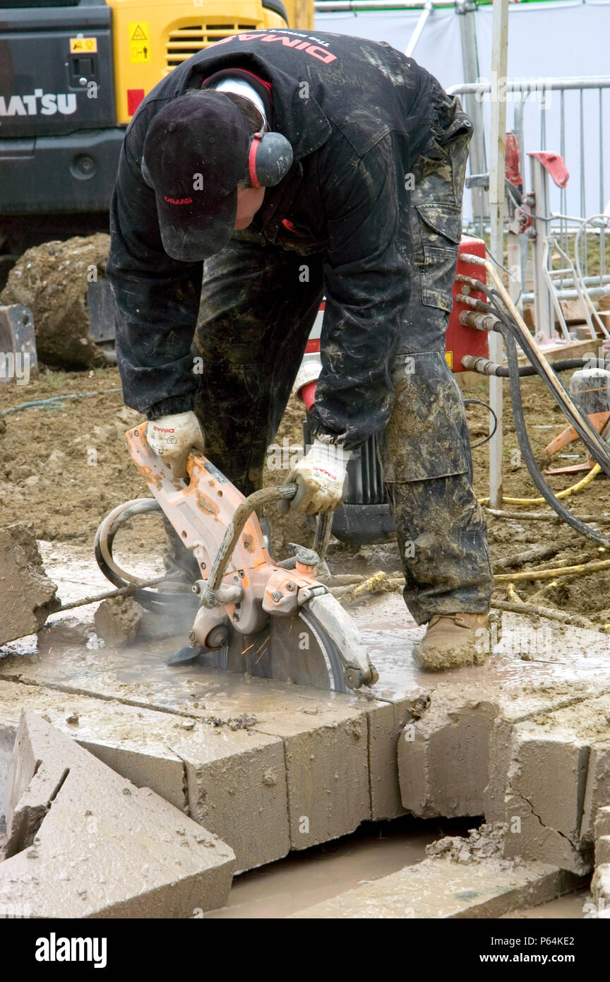 Builder using a circular saw without hard hat or high viz jacket Stock ...
