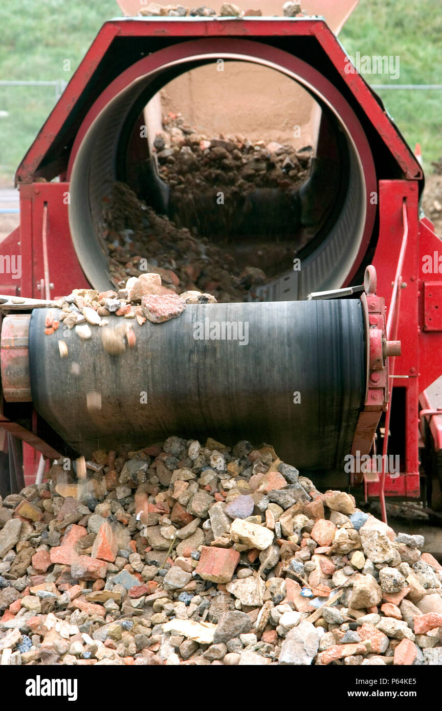 Waste management. Crushing stones and bricks Stock Photo - Alamy