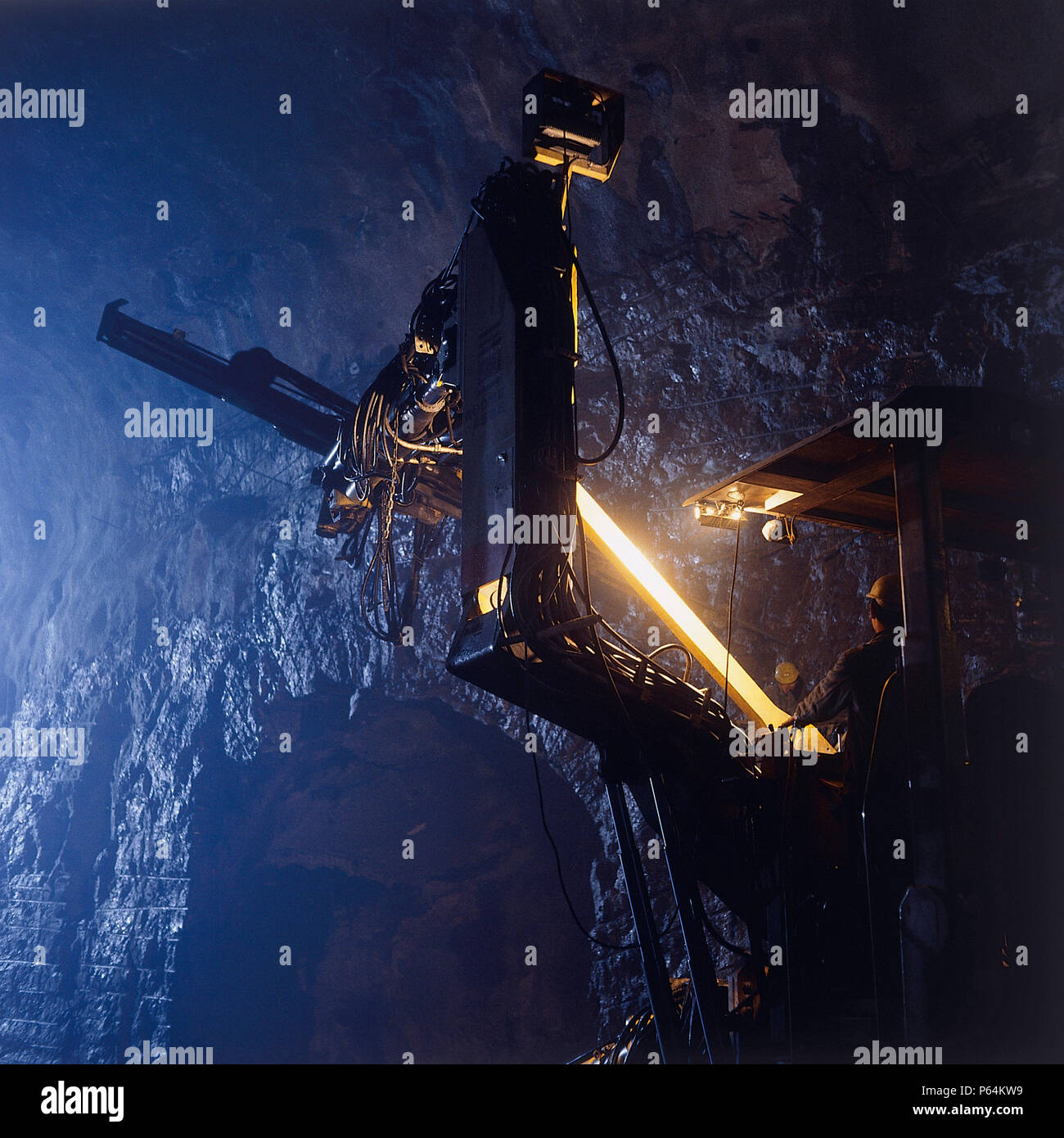 Atlas Copco Jumbo Drill Rig fixing rock anchors in pumphouse cavern ...
