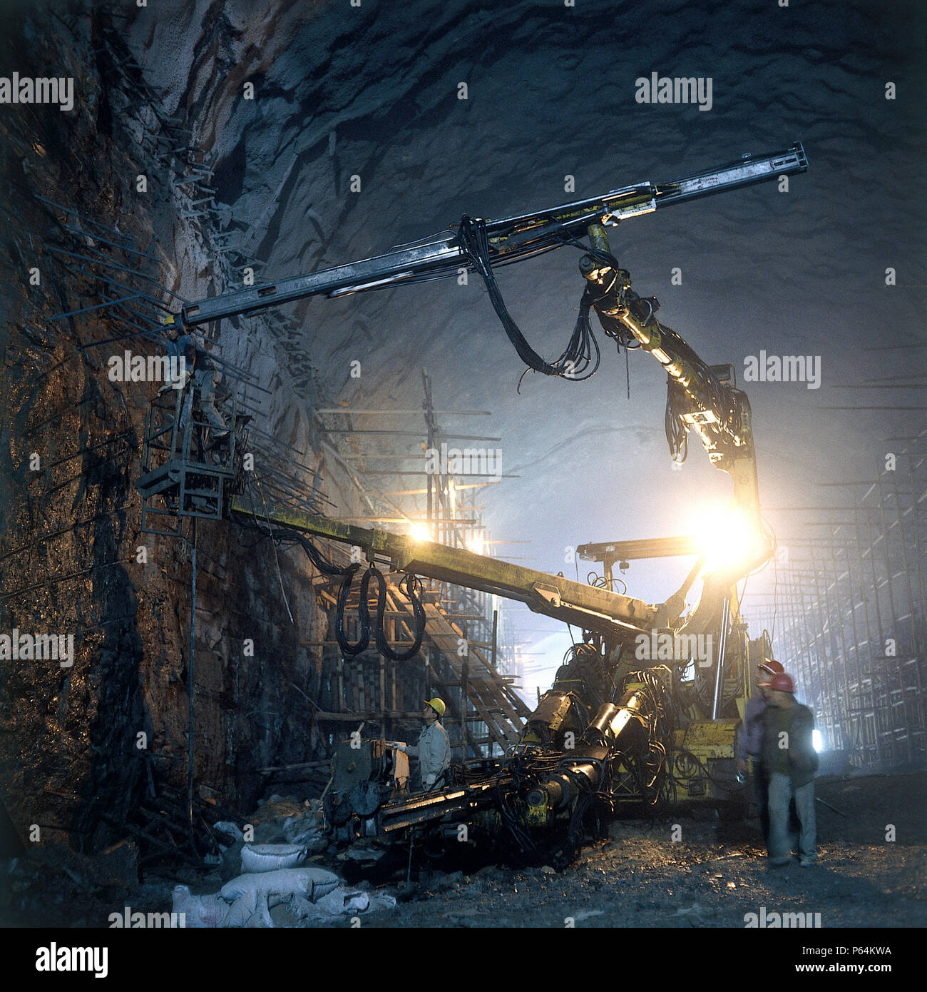 Atlas Copco Jumbo Drill Rig fixing rock anchors in pumphouse cavern ...
